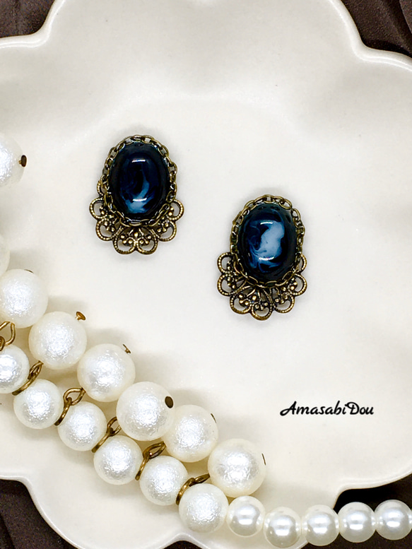 仄暗く揺らめく炎のピアス ピアス（スタッド・一粒） 雨錆堂 通販｜Creema(クリーマ) 9226909